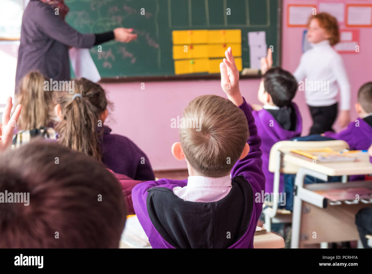 school children are participating actively in class. Education Stock ...