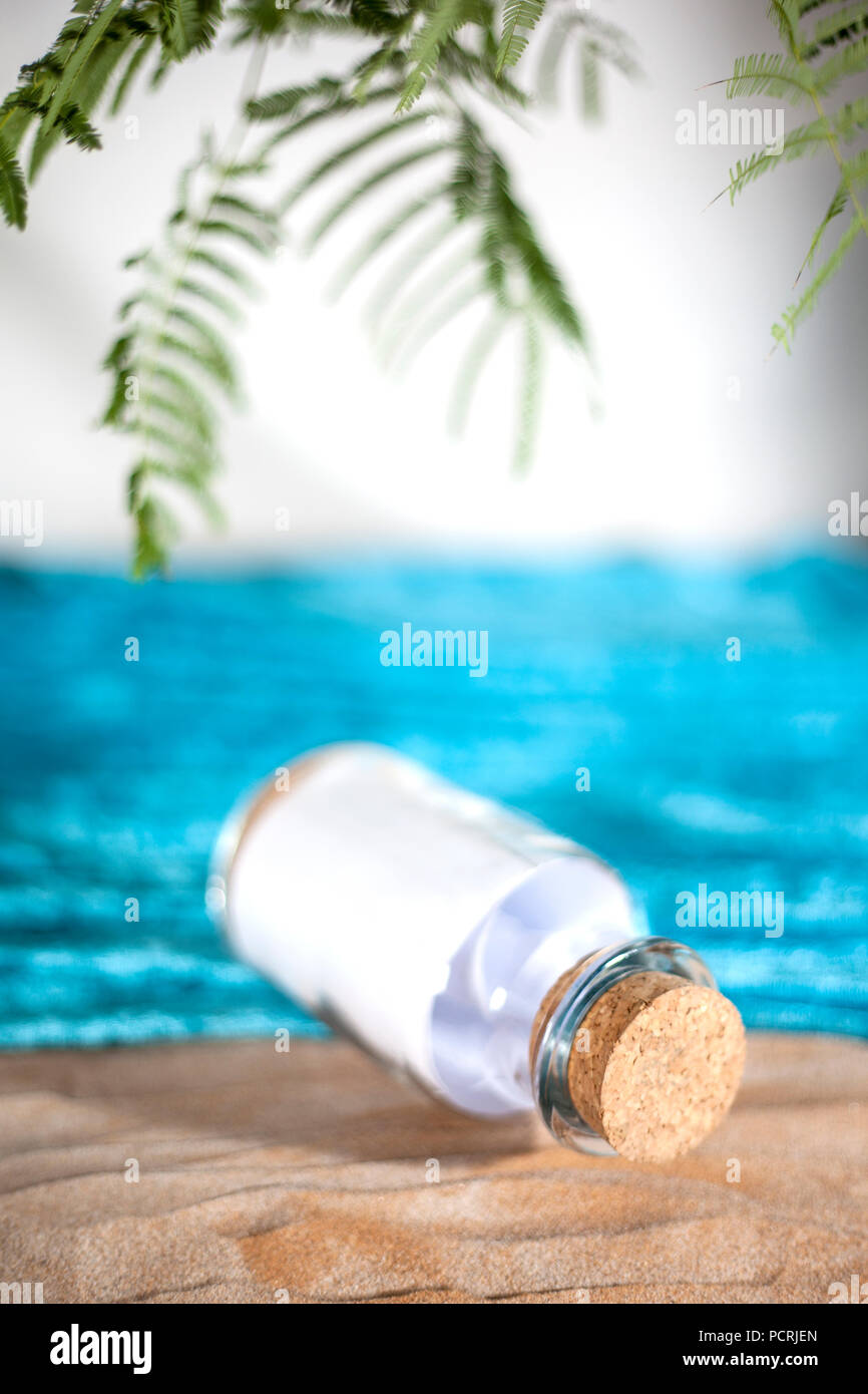 Stranded bottle message note paper with cork on a beautiful vacation ...