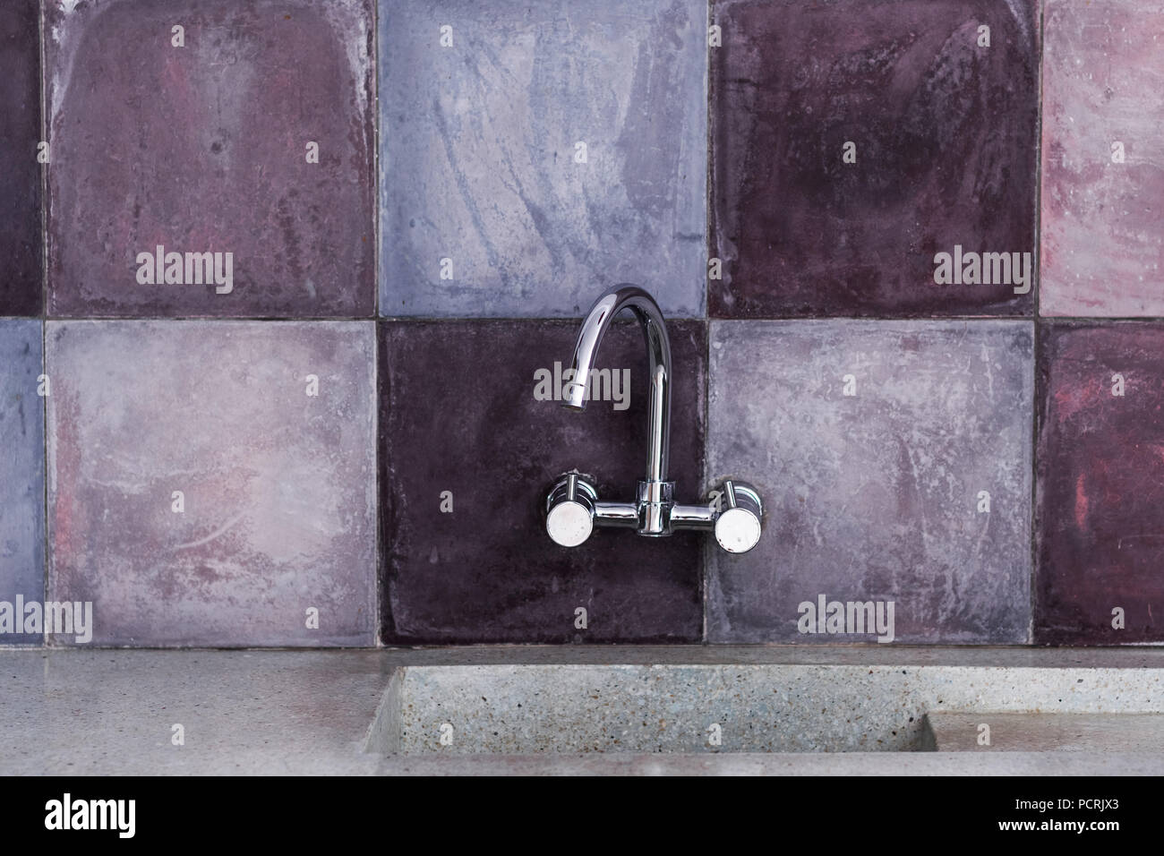 Kitchen faucet with trend stone background and marble sink Stock Photo ...
