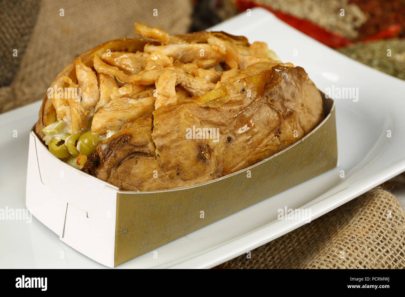 Kumpir / Turkish Baked potato with chicken meat Stock Photo - Alamy