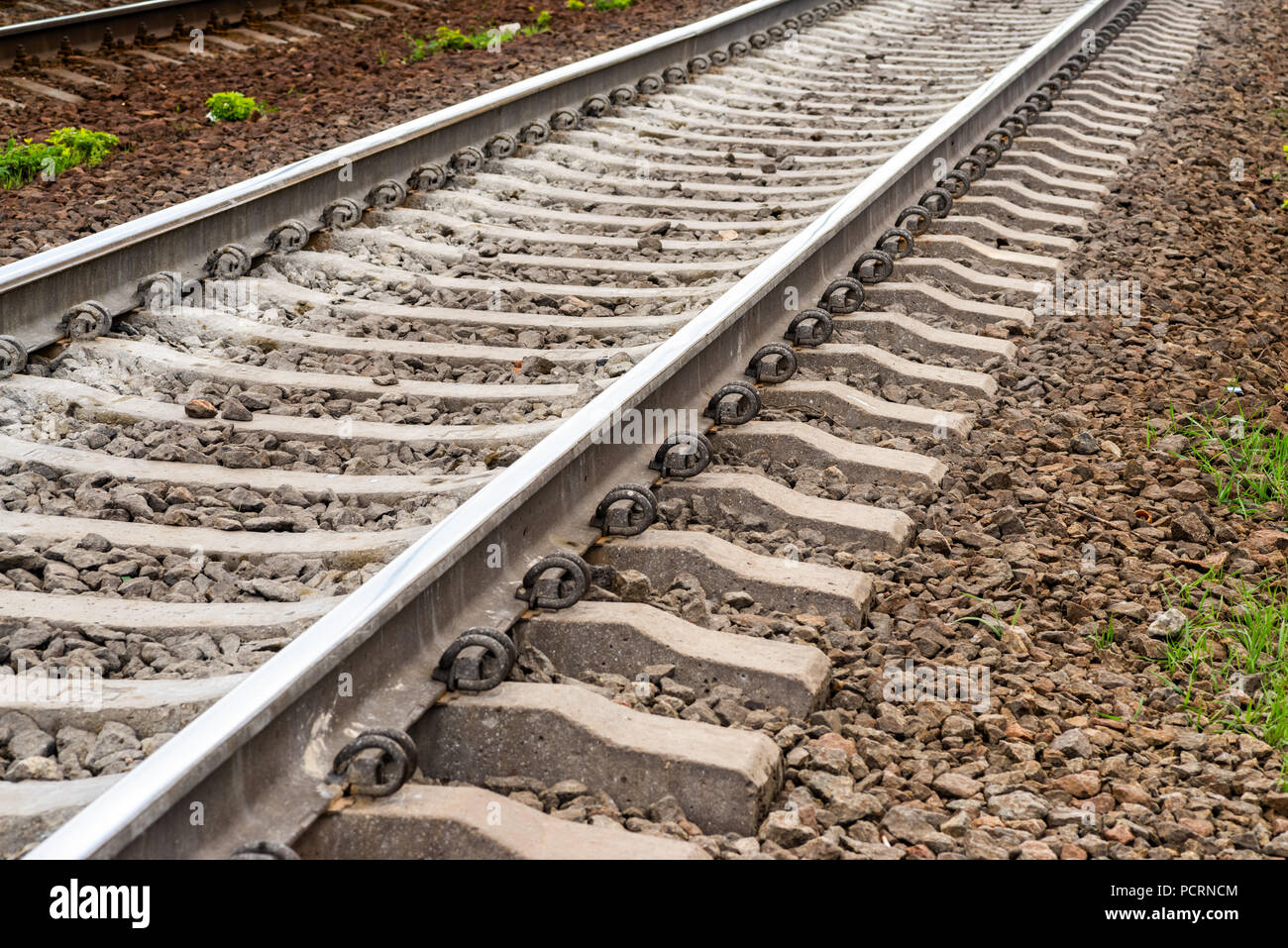 Railway rails with gravel Stock Photo - Alamy