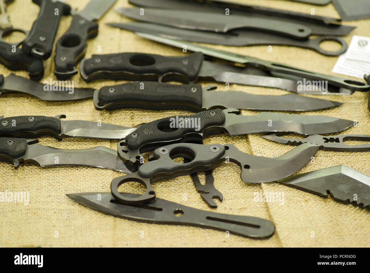 Metal knives on the table Stock Photo - Alamy