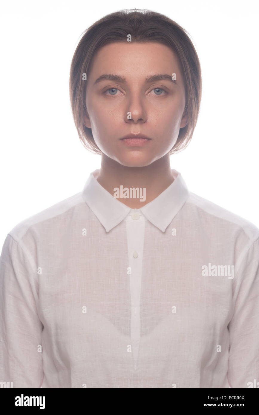 Serious business girl in white shirt. Studio portrait Stock Photo - Alamy