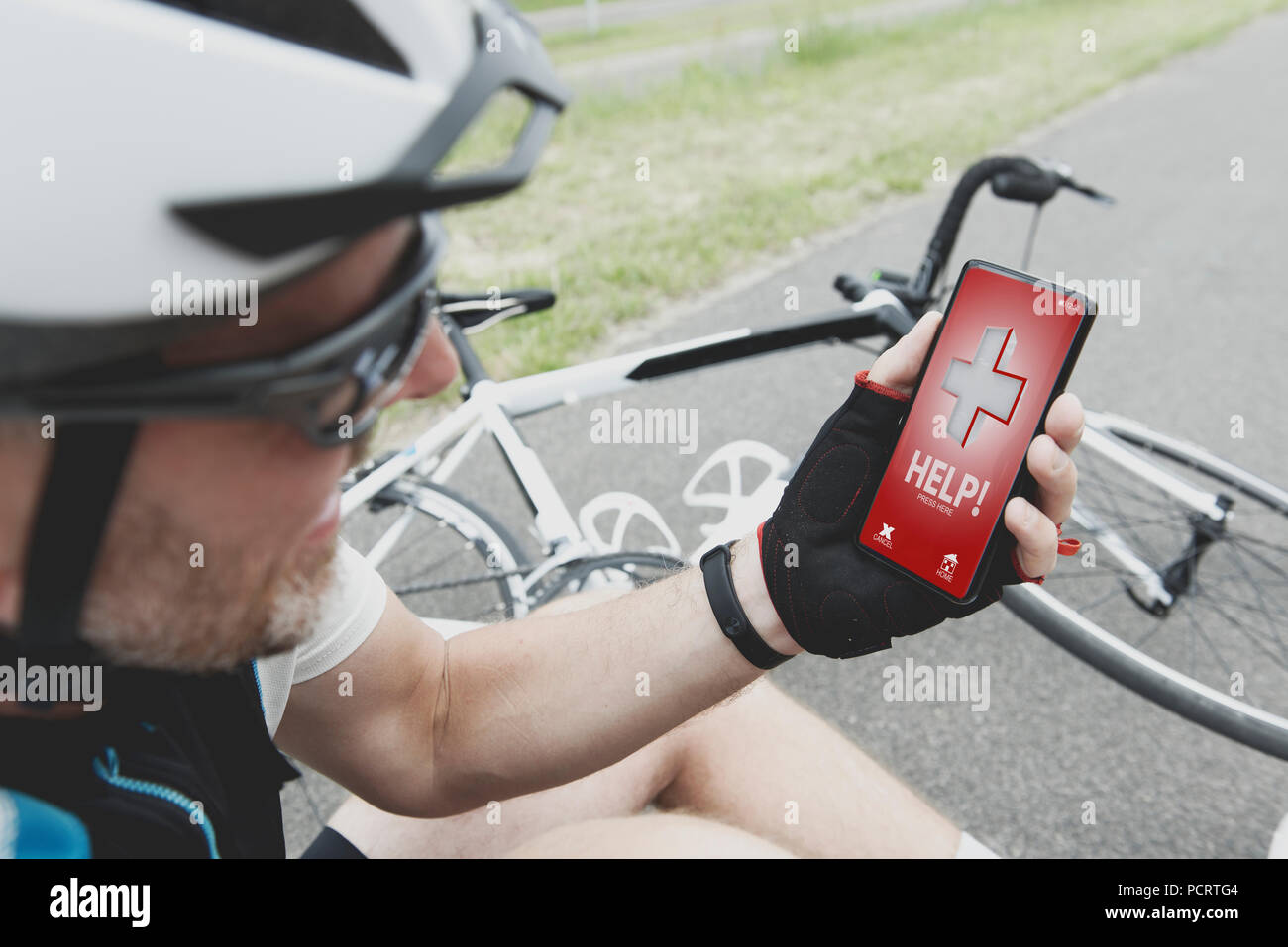 Injured biker holding his smartphone calling rescue team with simple ...