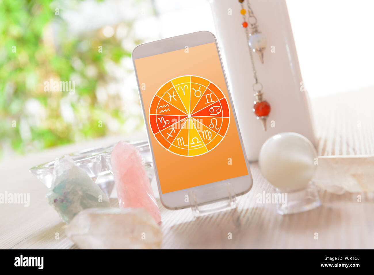 Zodiac signs and smart phone with crystal balls. Concept of modern ...