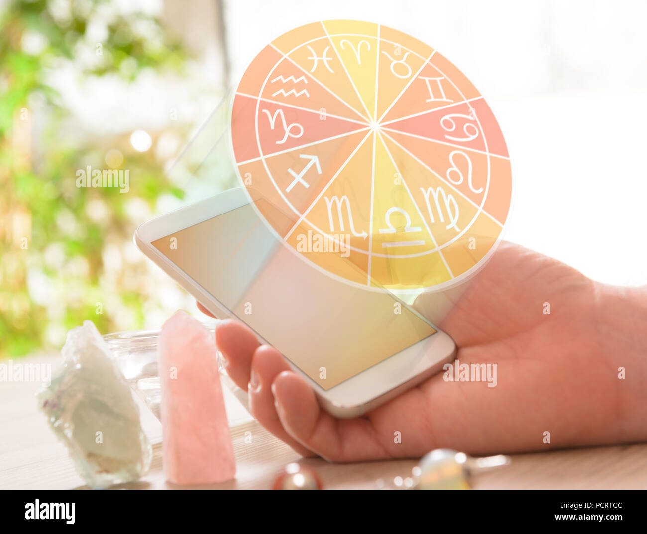 Zodiac signs and smart phone in hand. Concept of modern astrology Stock ...