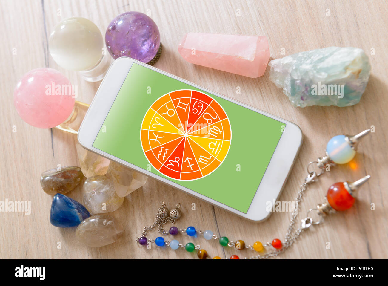 Zodiac signs and smart phone with crystal balls. Concept of modern ...