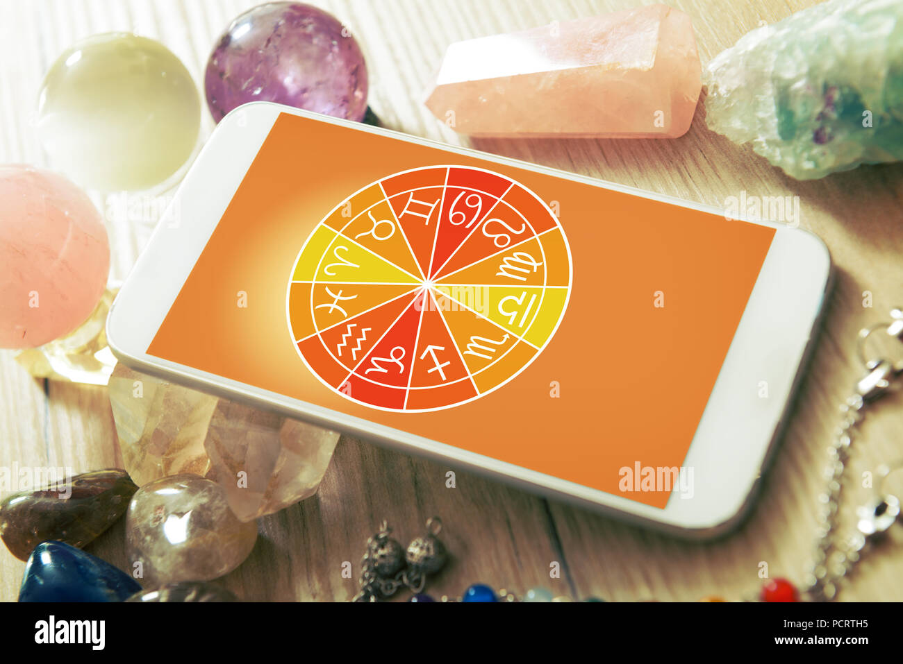 Zodiac signs and smart phone with crystal balls. Concept of modern ...