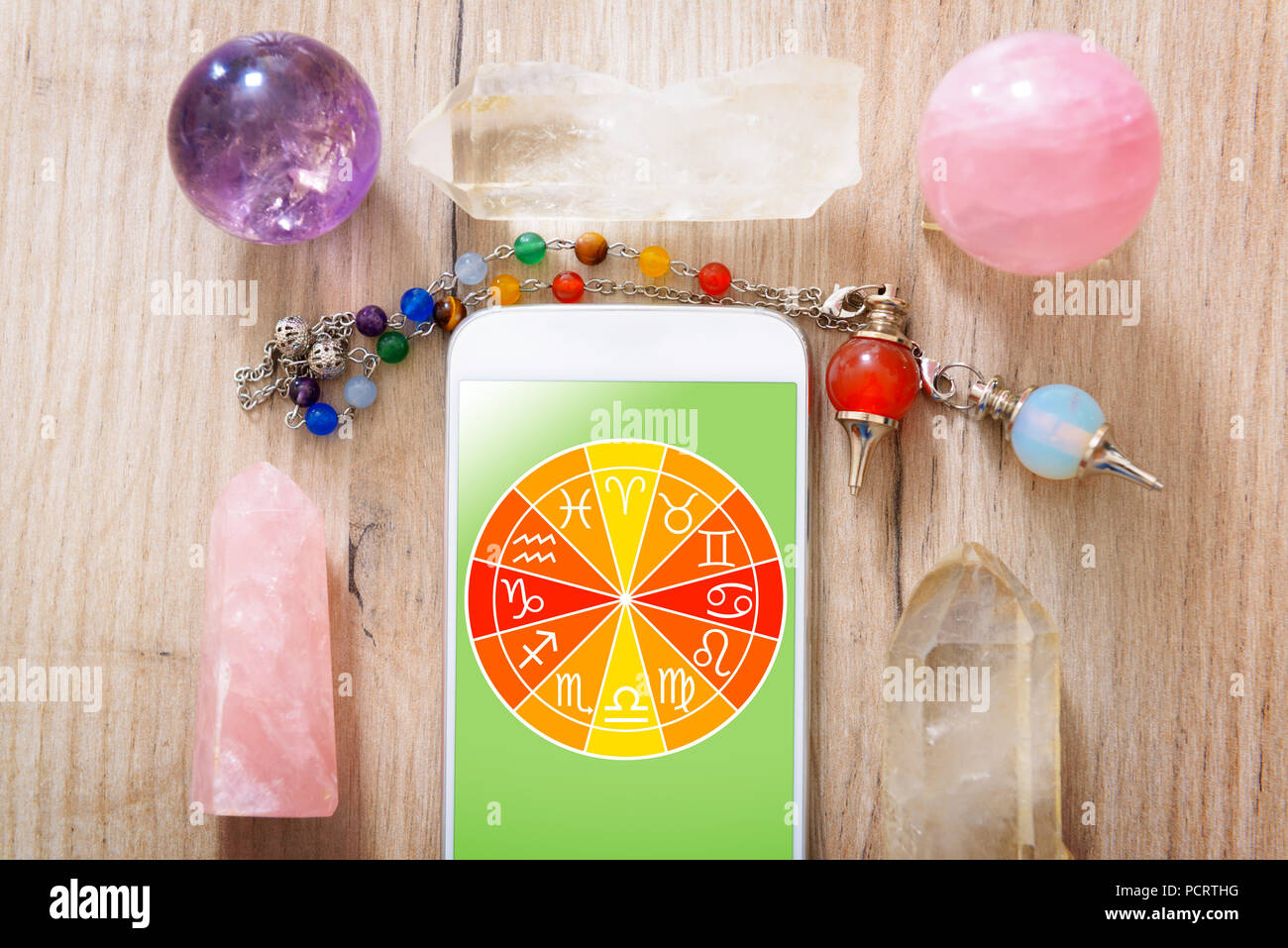 Zodiac signs and smart phone with crystal balls. Concept of modern ...