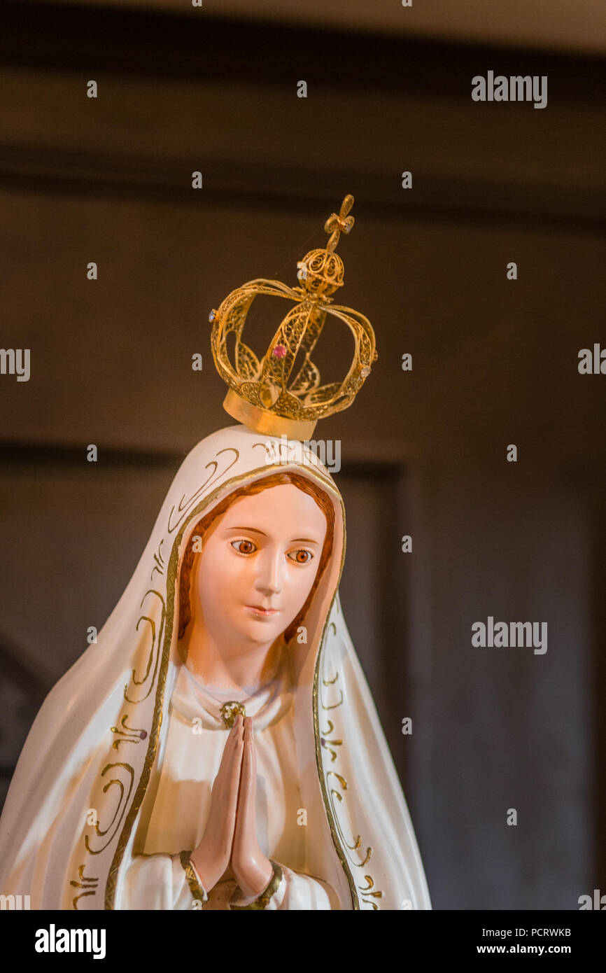 RAVENNA, ITALY - august 2, 2018: Statue of Our Lady of Fatima praying ...