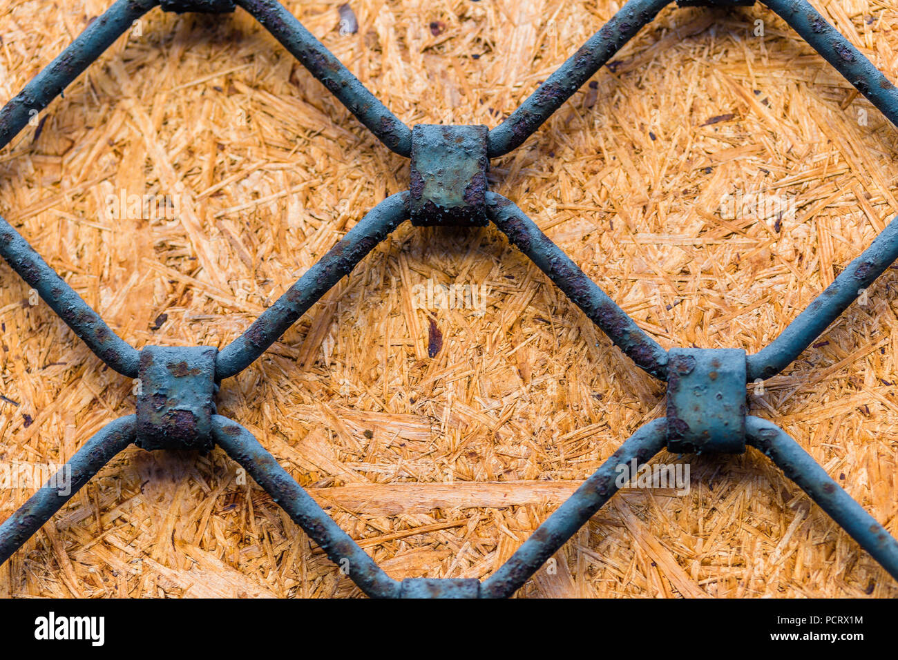 Vintage Metal Grate on Oriented strand board Stock Photo - Alamy