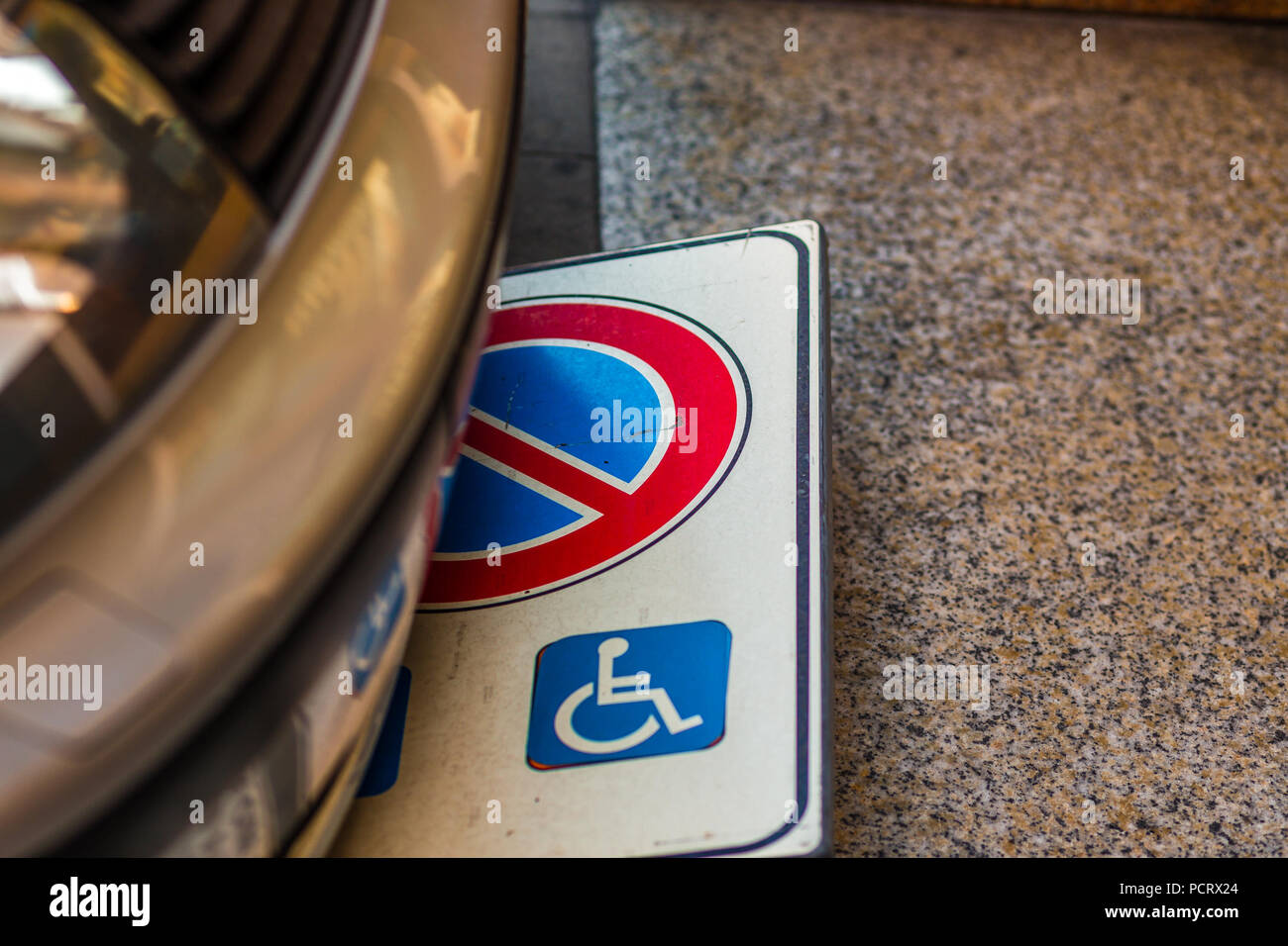 Parking sign for handicapped people hit by a car Stock Photo - Alamy