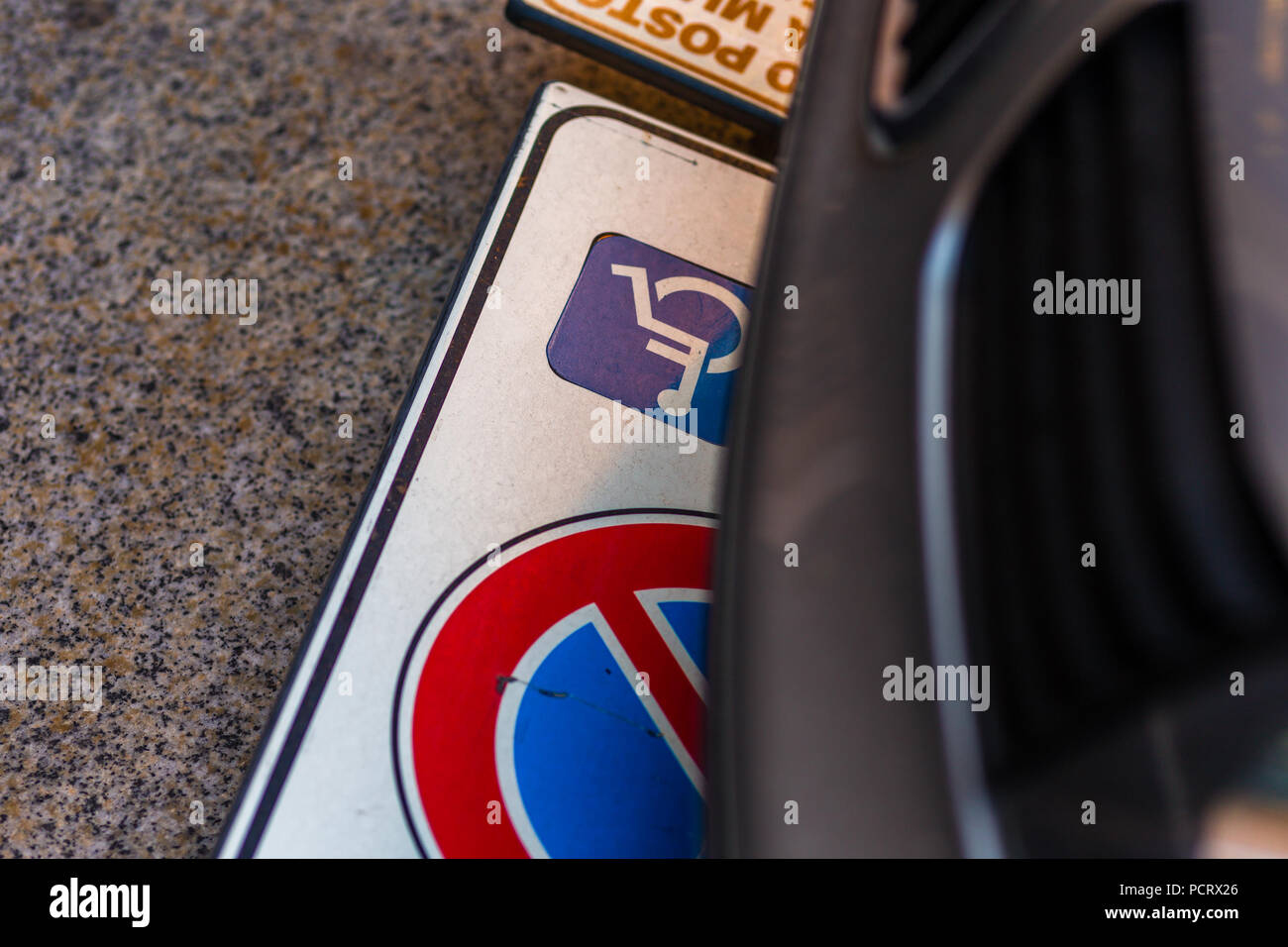 Parking sign for handicapped people hit by a car Stock Photo - Alamy