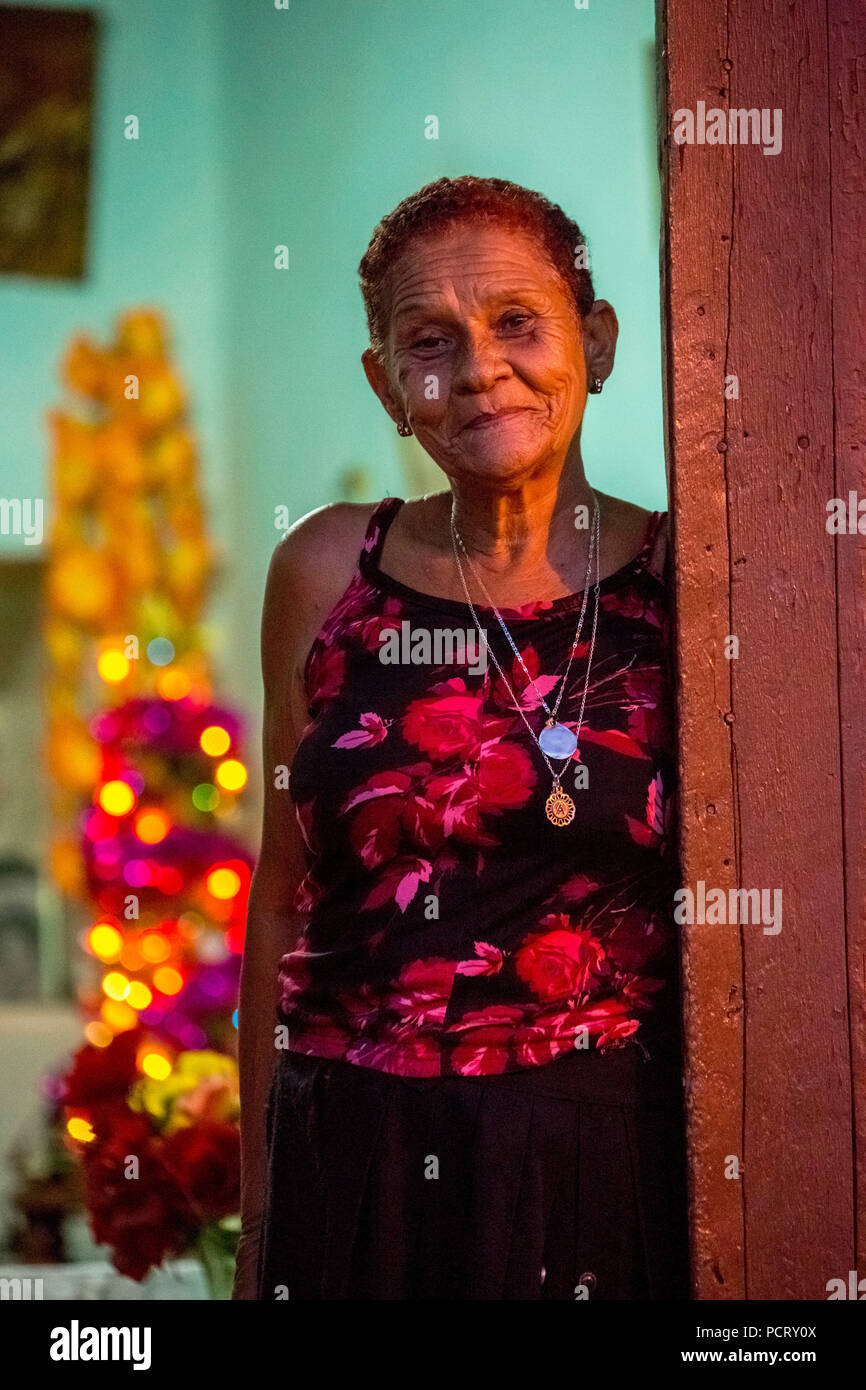 old lady looks friendly from her front door, street scene in the ...