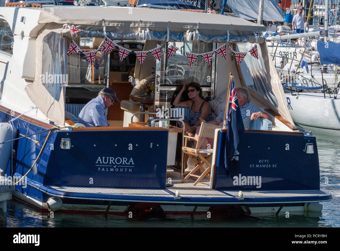 people relaxing on the after or stern back deck of a large and powerful ...