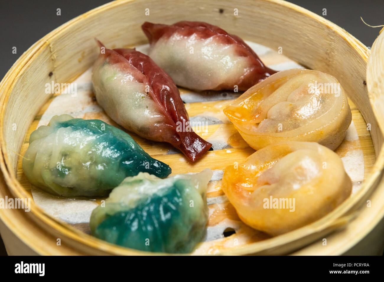 Dim Sum in a steamed wooden basket Closeup Stock Photo - Alamy