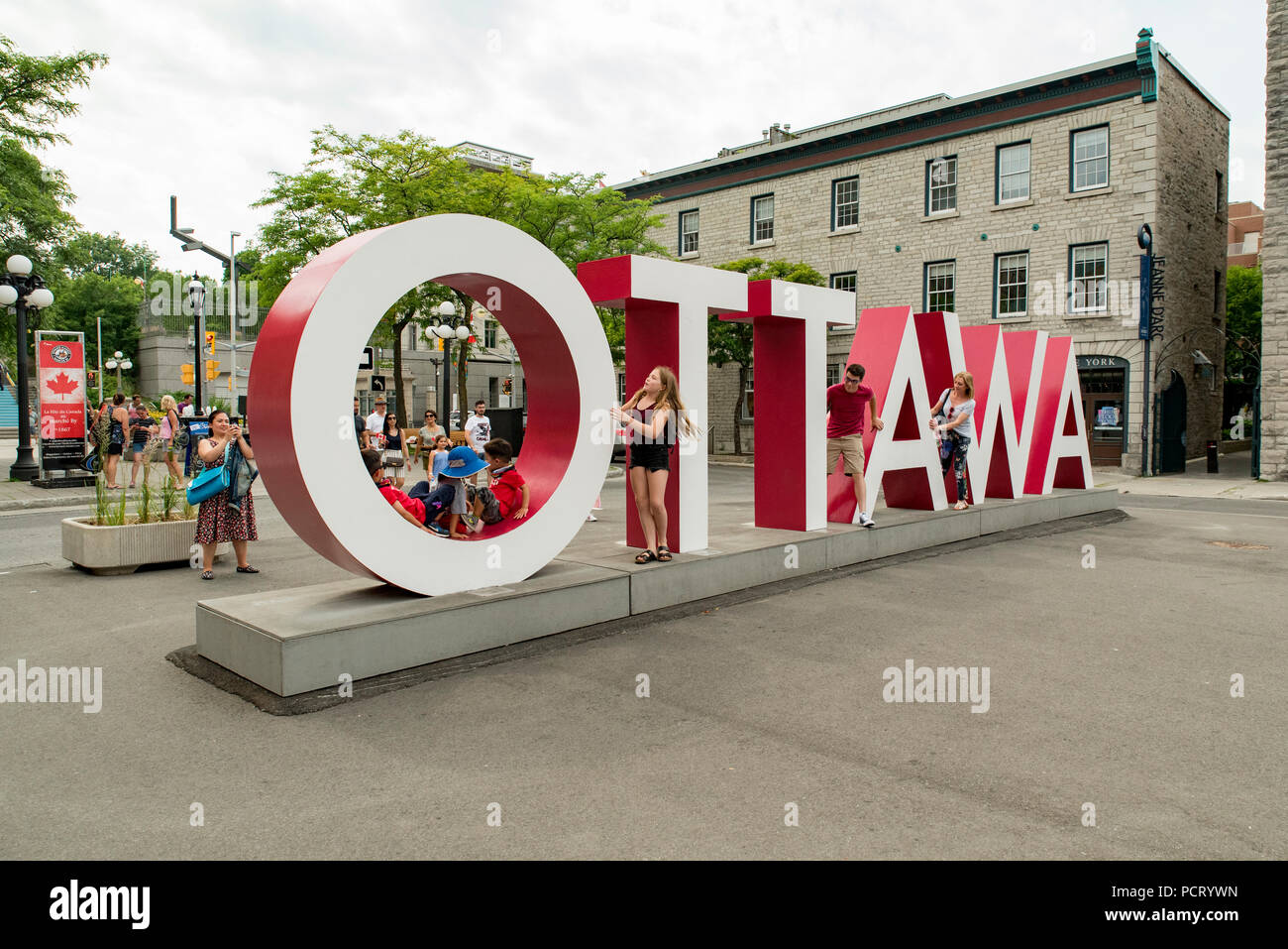 Ottawa, Ontario, Canada. Tourists posing at the Ottawa letters on York ...