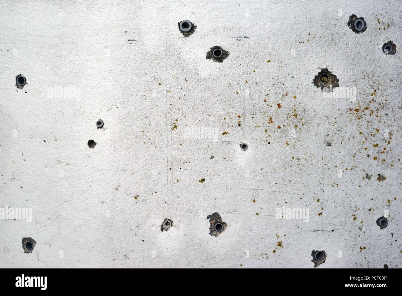 Different sizes of holes with plastic dowels in concrete Stock Photo ...