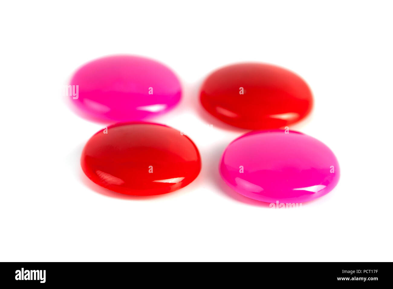 Colorful magnets - holders on a white background Stock Photo - Alamy