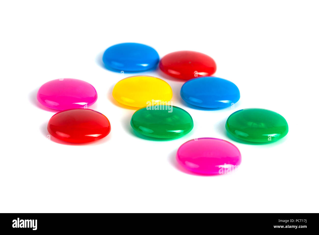 Colorful magnets - holders on a white background Stock Photo - Alamy