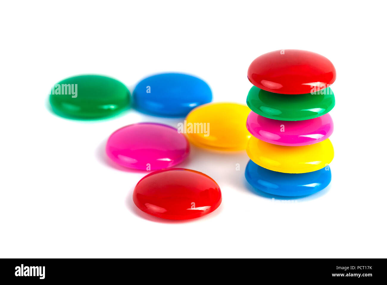 Colorful magnets - holders on a white background Stock Photo - Alamy