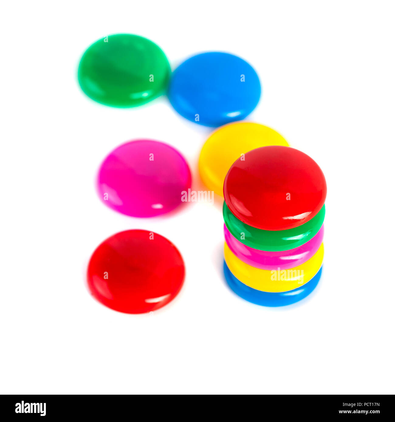 Colorful magnets - holders on a white background Stock Photo - Alamy