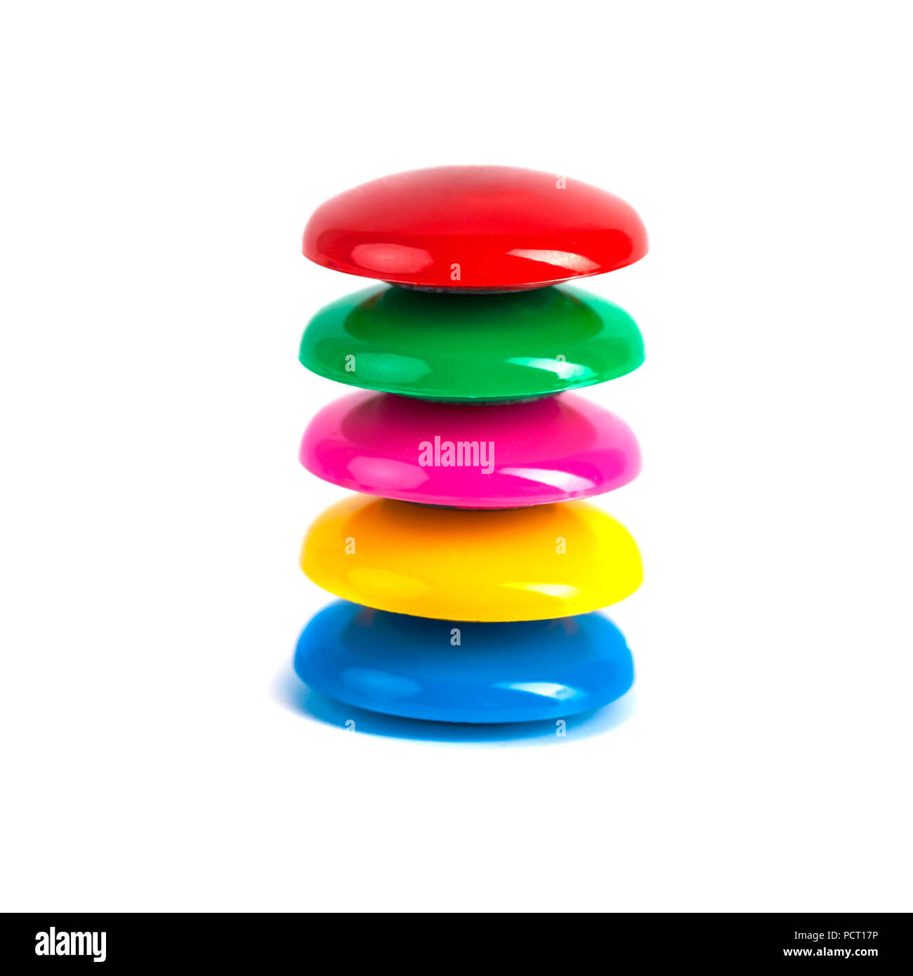 Colorful magnets - holders on a white background Stock Photo - Alamy