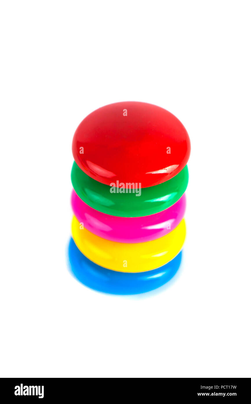 Colorful magnets - holders on a white background Stock Photo - Alamy