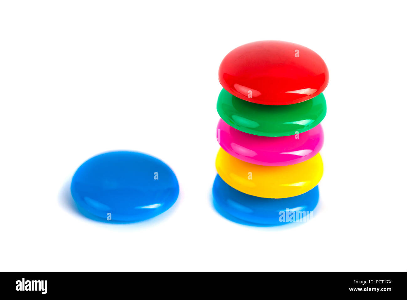 Colorful magnets - holders on a white background Stock Photo - Alamy