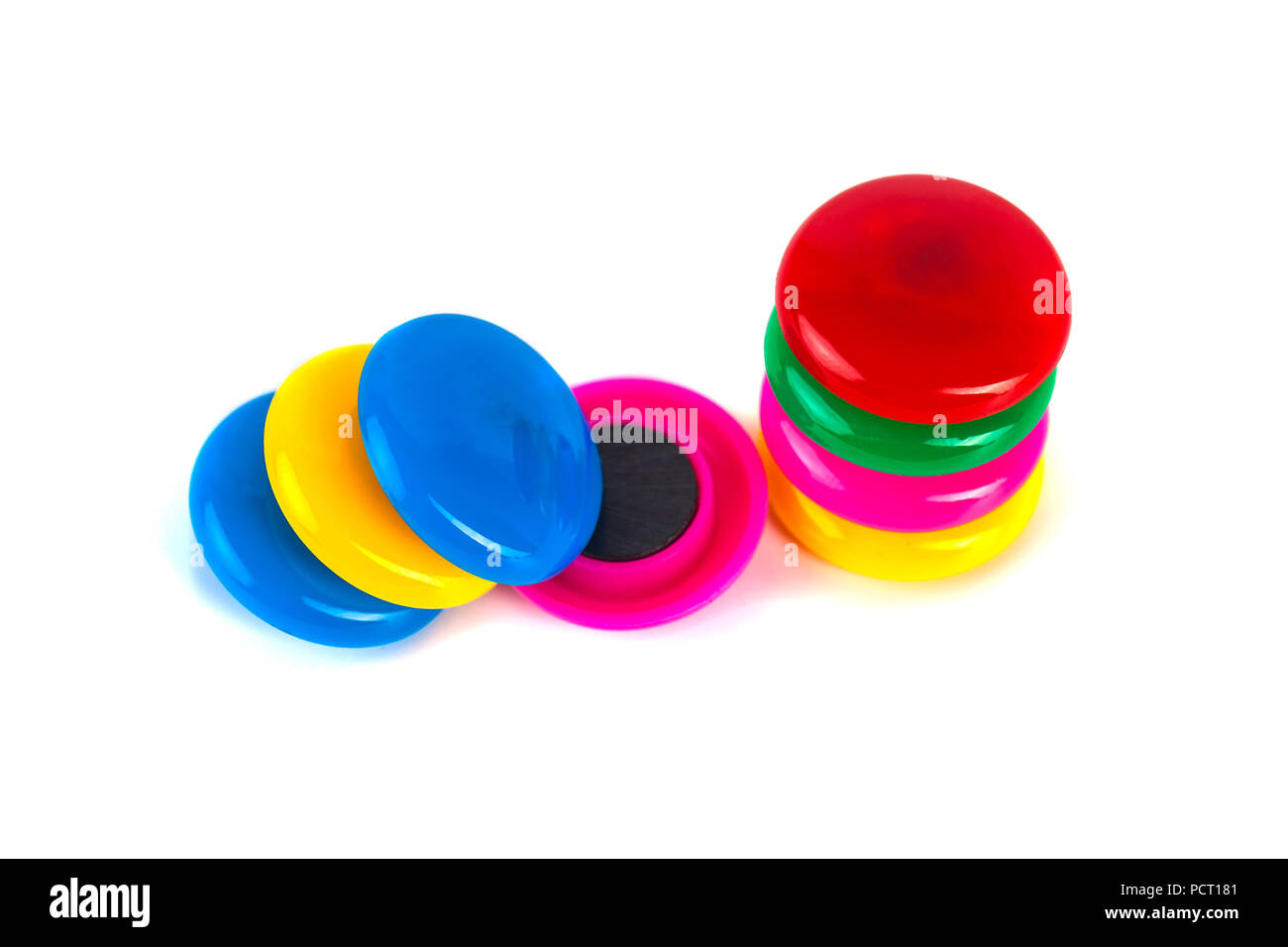 Colorful magnets - holders on a white background Stock Photo - Alamy