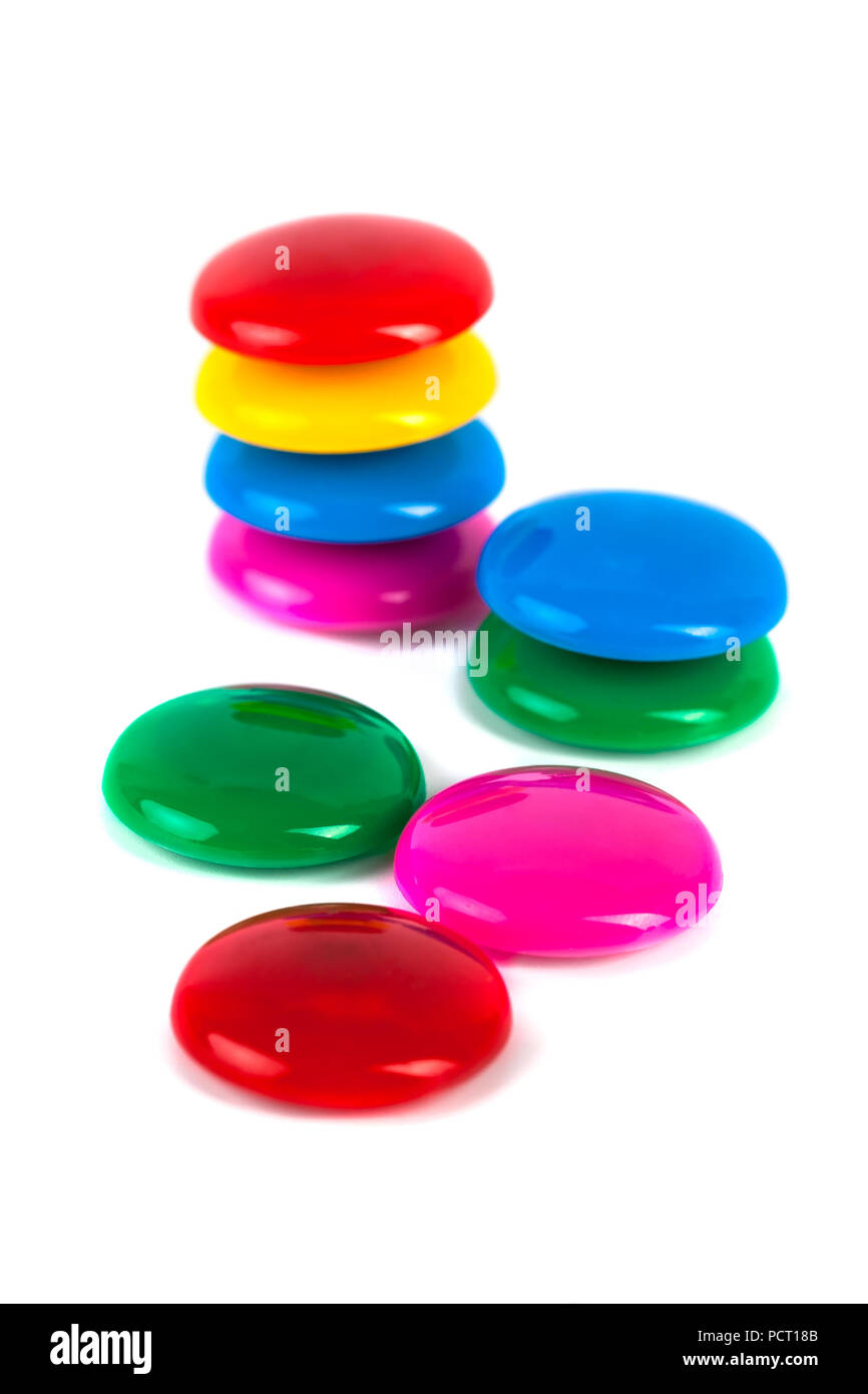 Colorful magnets - holders on a white background Stock Photo - Alamy