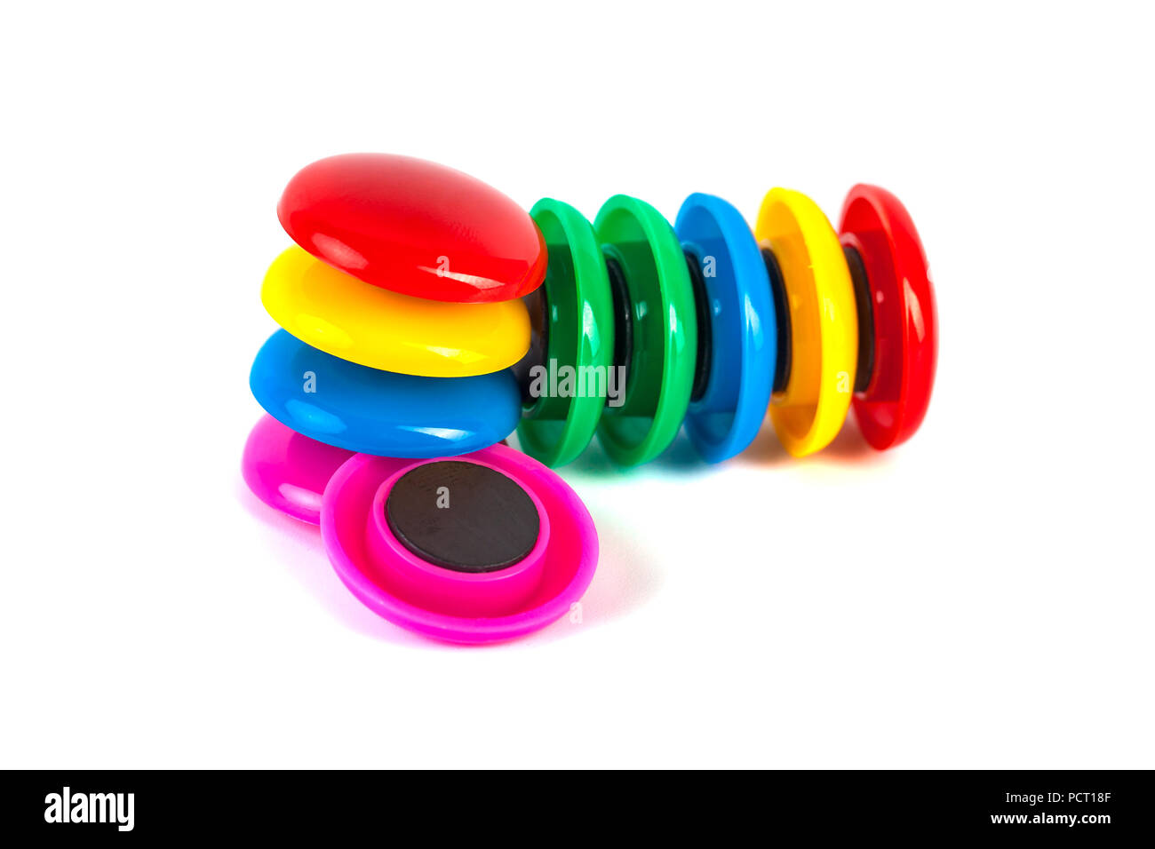 Colorful magnets - holders on a white background Stock Photo - Alamy