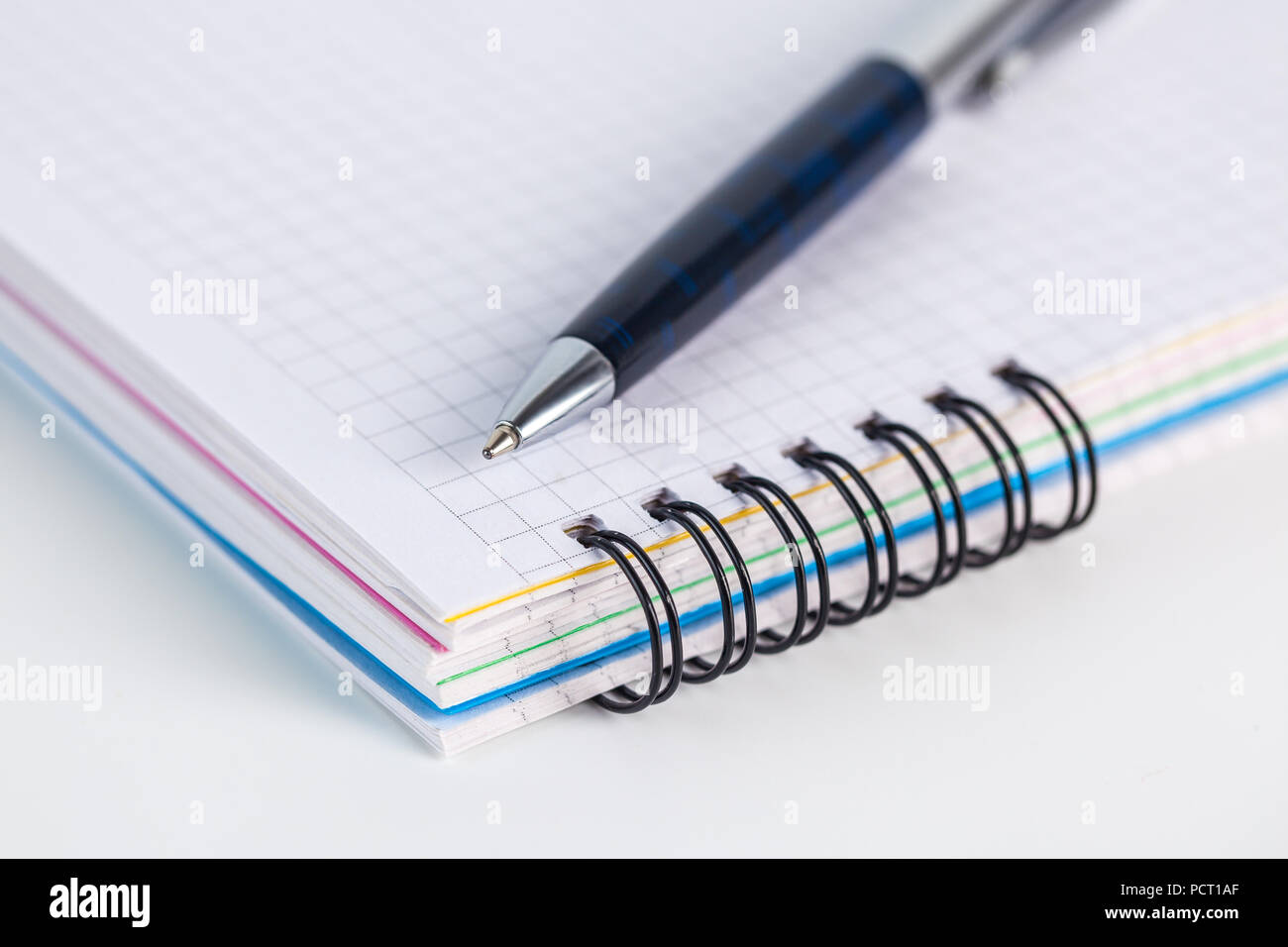 Blue ballpoint pen on the notebook, object Stock Photo - Alamy