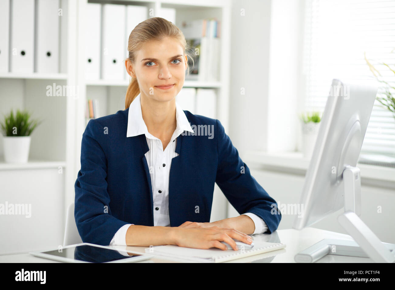 Modern business woman or confident female accountant in office. Student ...