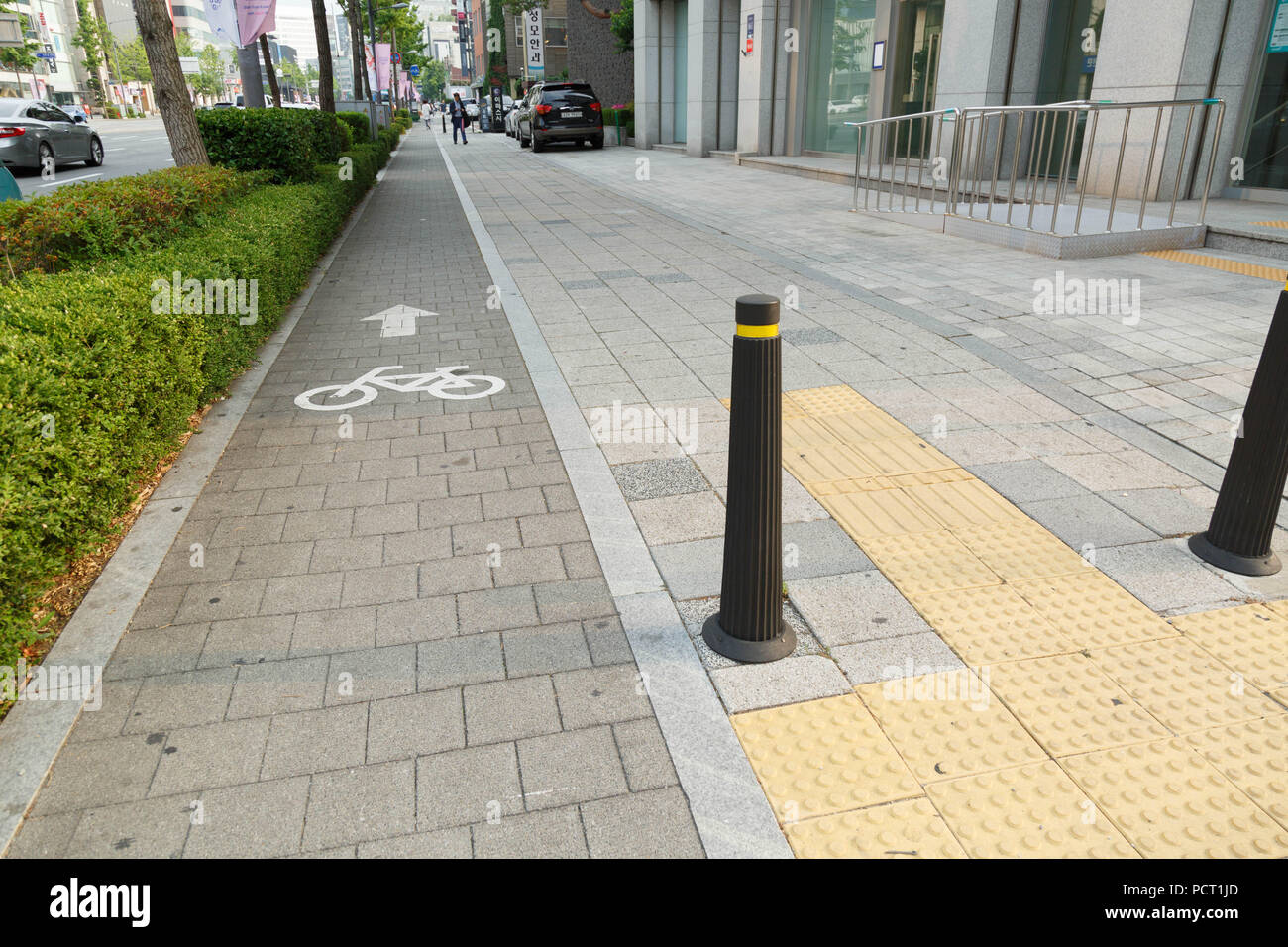 A sidewalk with designated bicycle lane in Gangnam district, Seoul ...