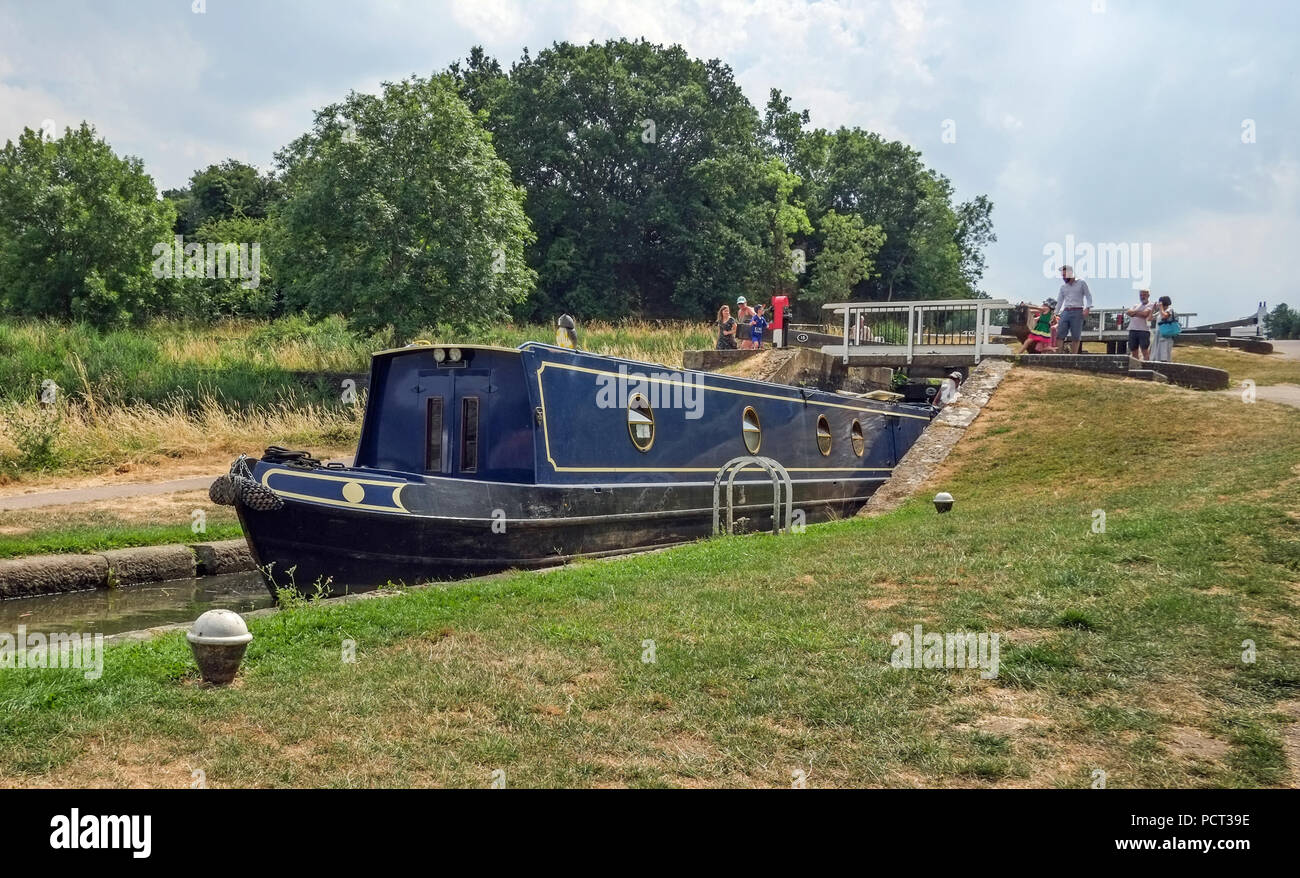 Narro boat descending from lock gate at Foxton Locks Market Harbour UK ...