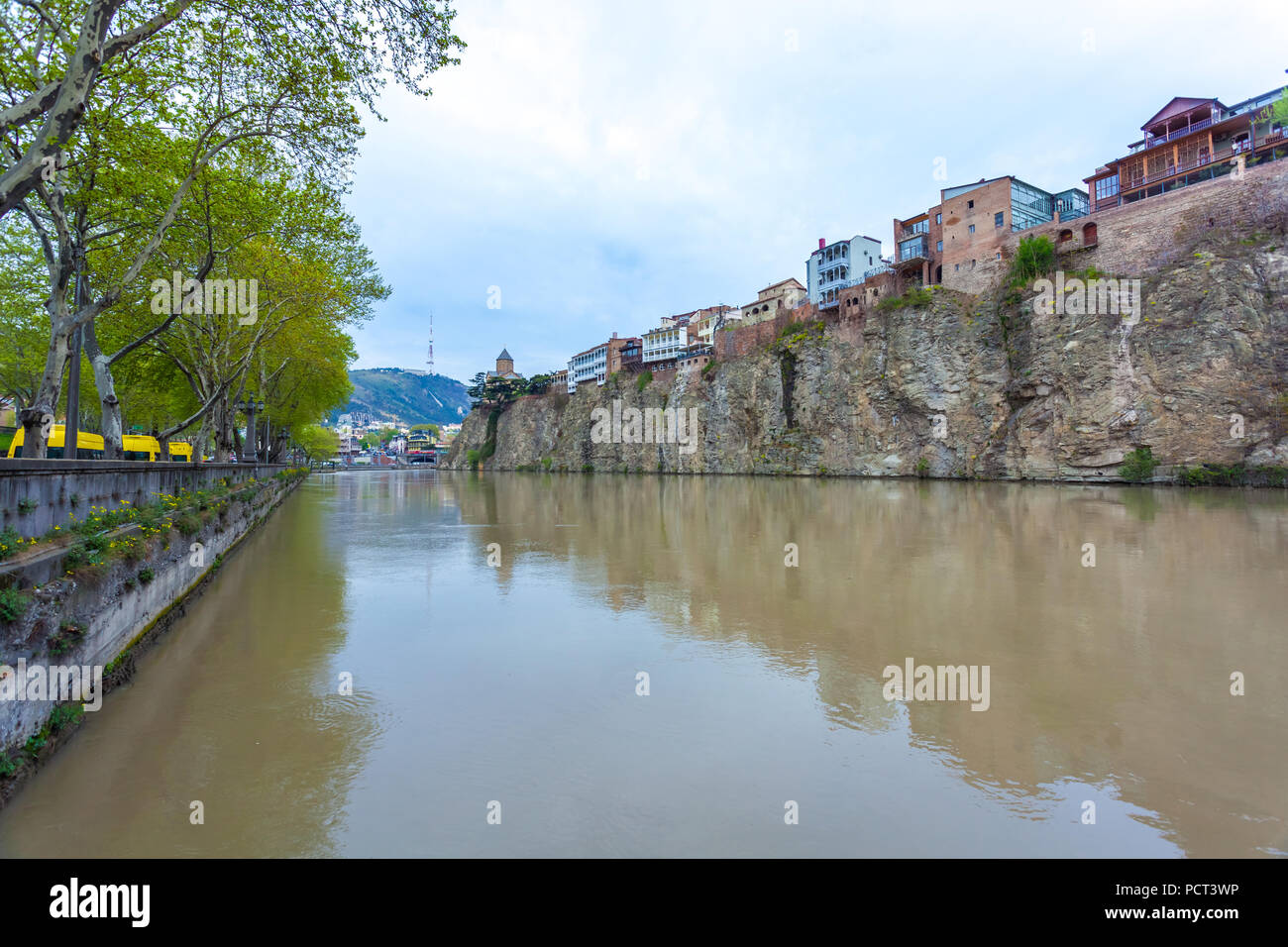 Metekhi church and Houses on the edge of a cliff above the river Kura ...