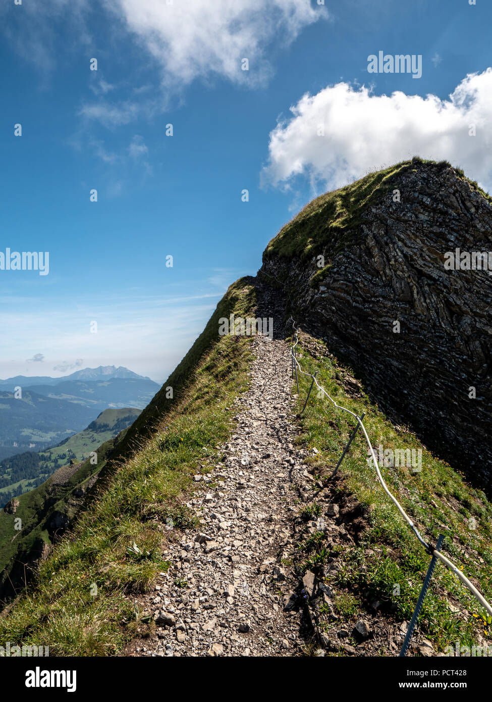 scary ridge walk high up in the swiss mountains alps hiking path ...