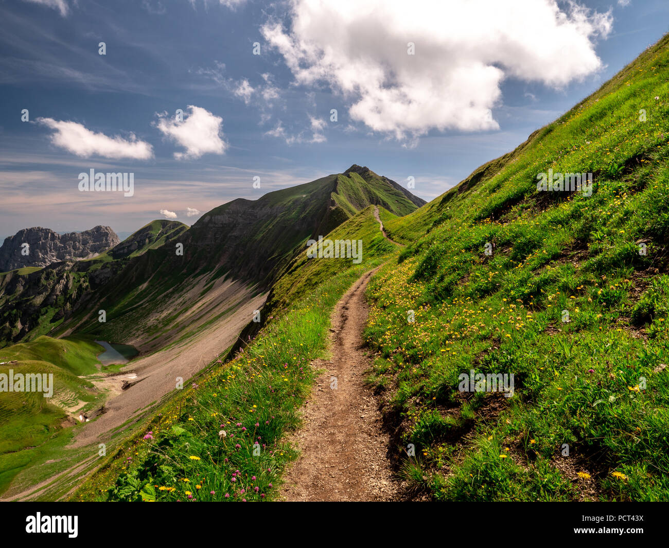 scary hiking path with beautiful scenery view over the swiss alps and ...
