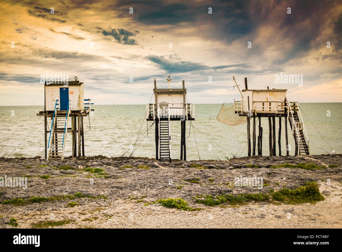 Three stilted fishing huts in Royan France built on elevated boardwalks ...