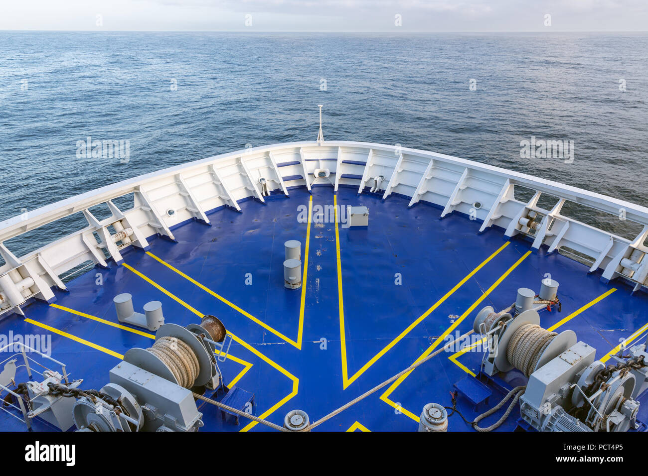 Ship bow with mooring gear like winches and anchor chains Stock Photo ...