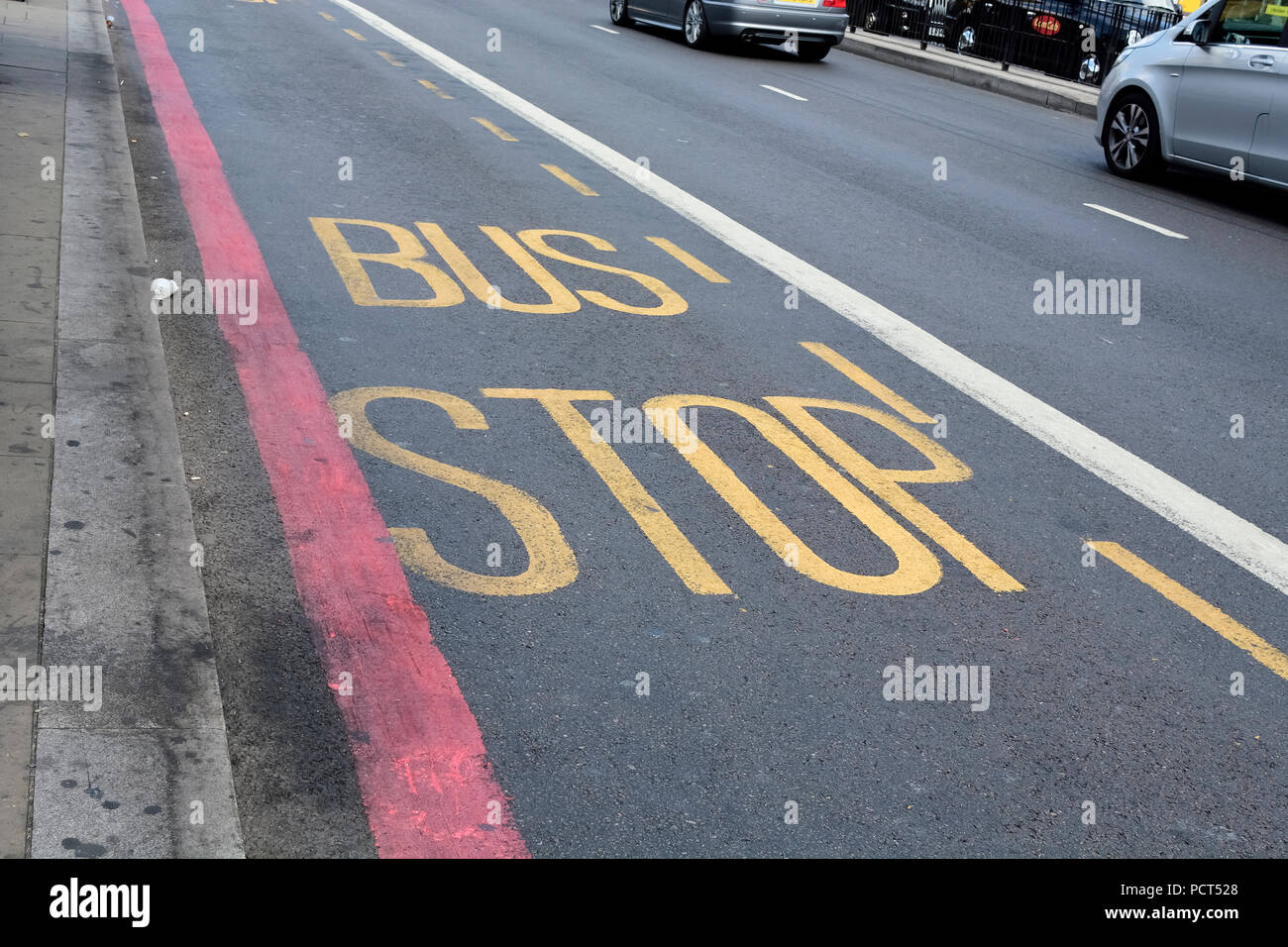 Written bus stop sign on road, at London, UK Stock Photo - Alamy