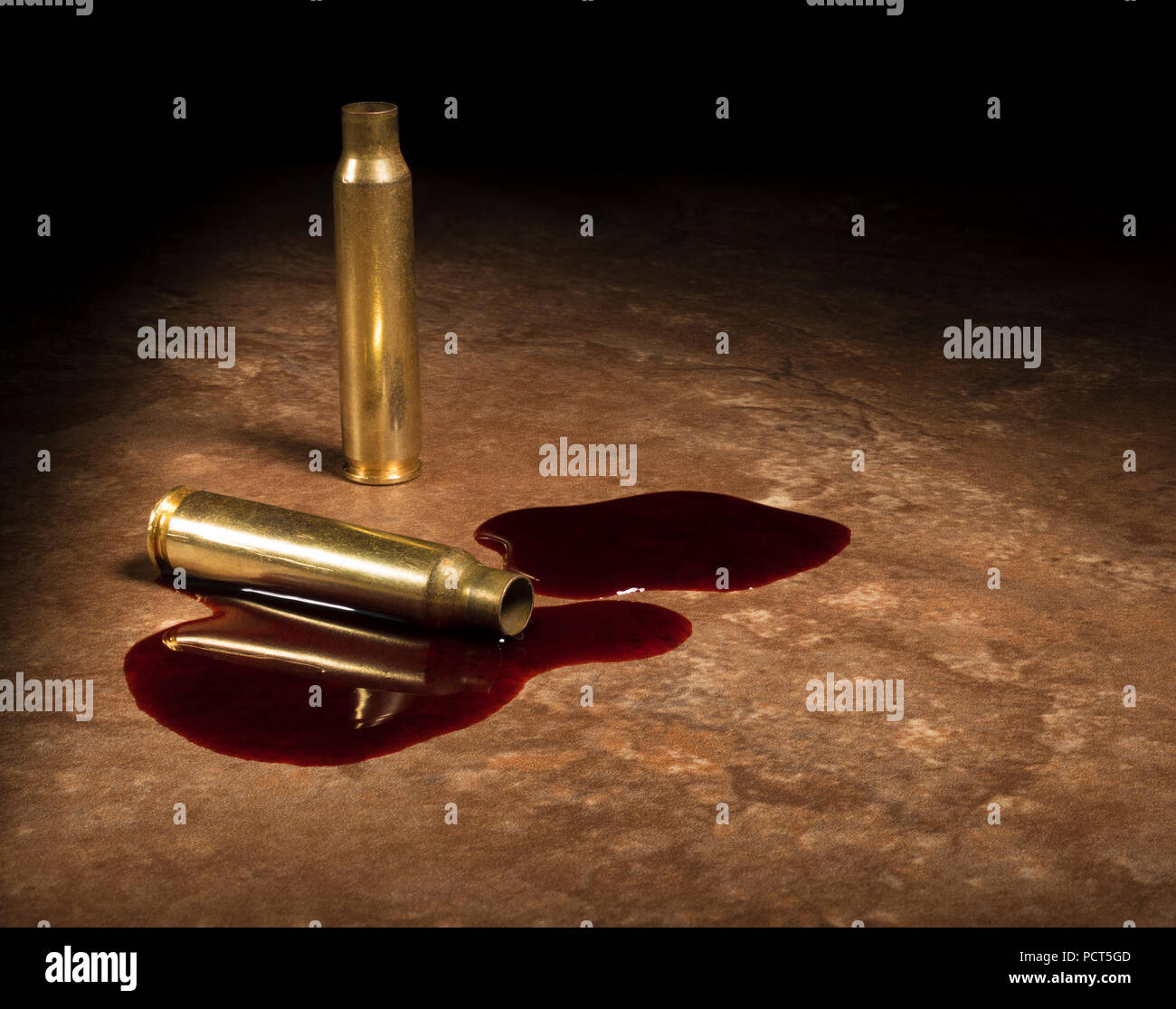 Assault rifle brass that's been shot on the flood with blood Stock ...