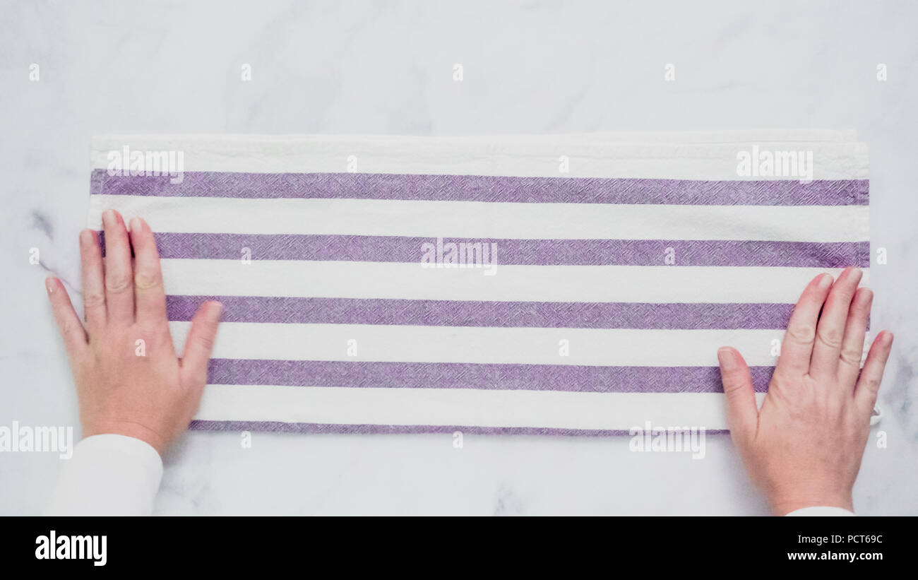 Folding blue and white patterned paper towels on marble surface Stock ...