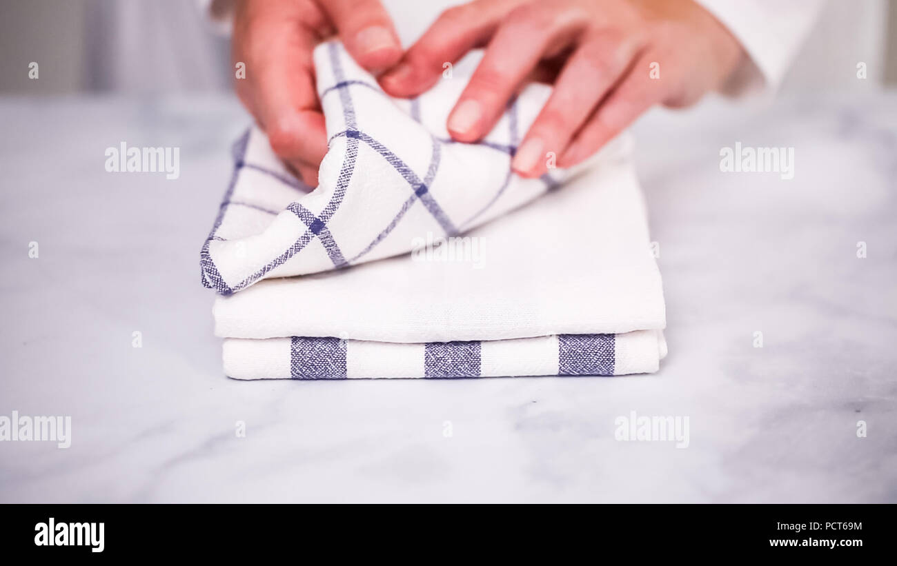 Folding blue and white patterned paper towels on marble surface Stock ...