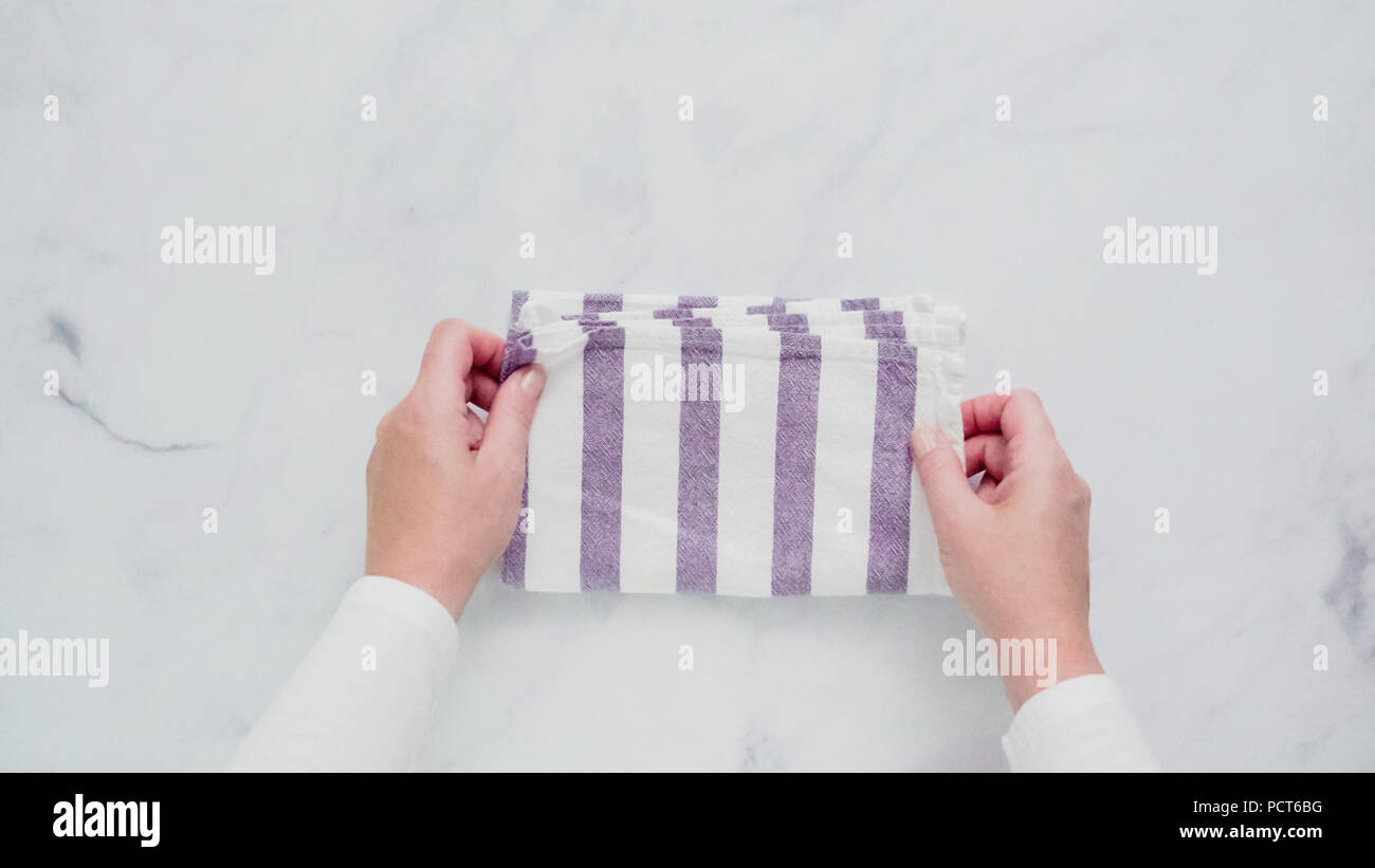Folding blue and white patterned paper towels on marble surface Stock ...
