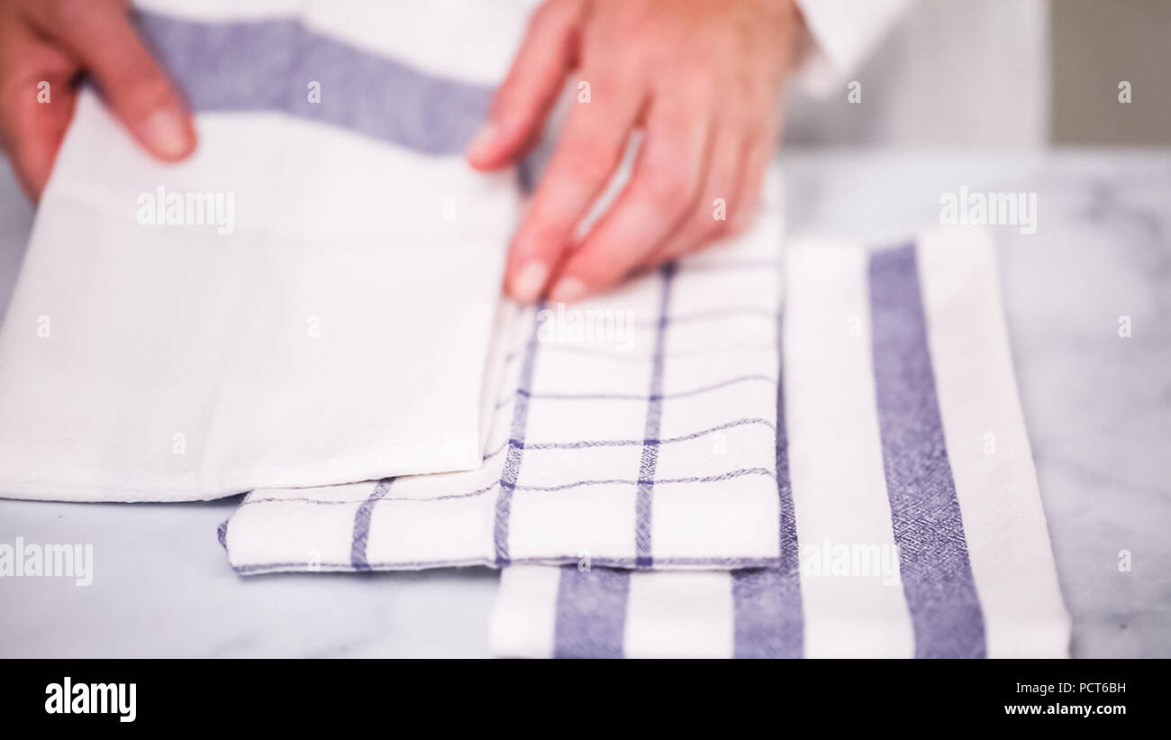 Folding blue and white patterned paper towels on marble surface Stock ...
