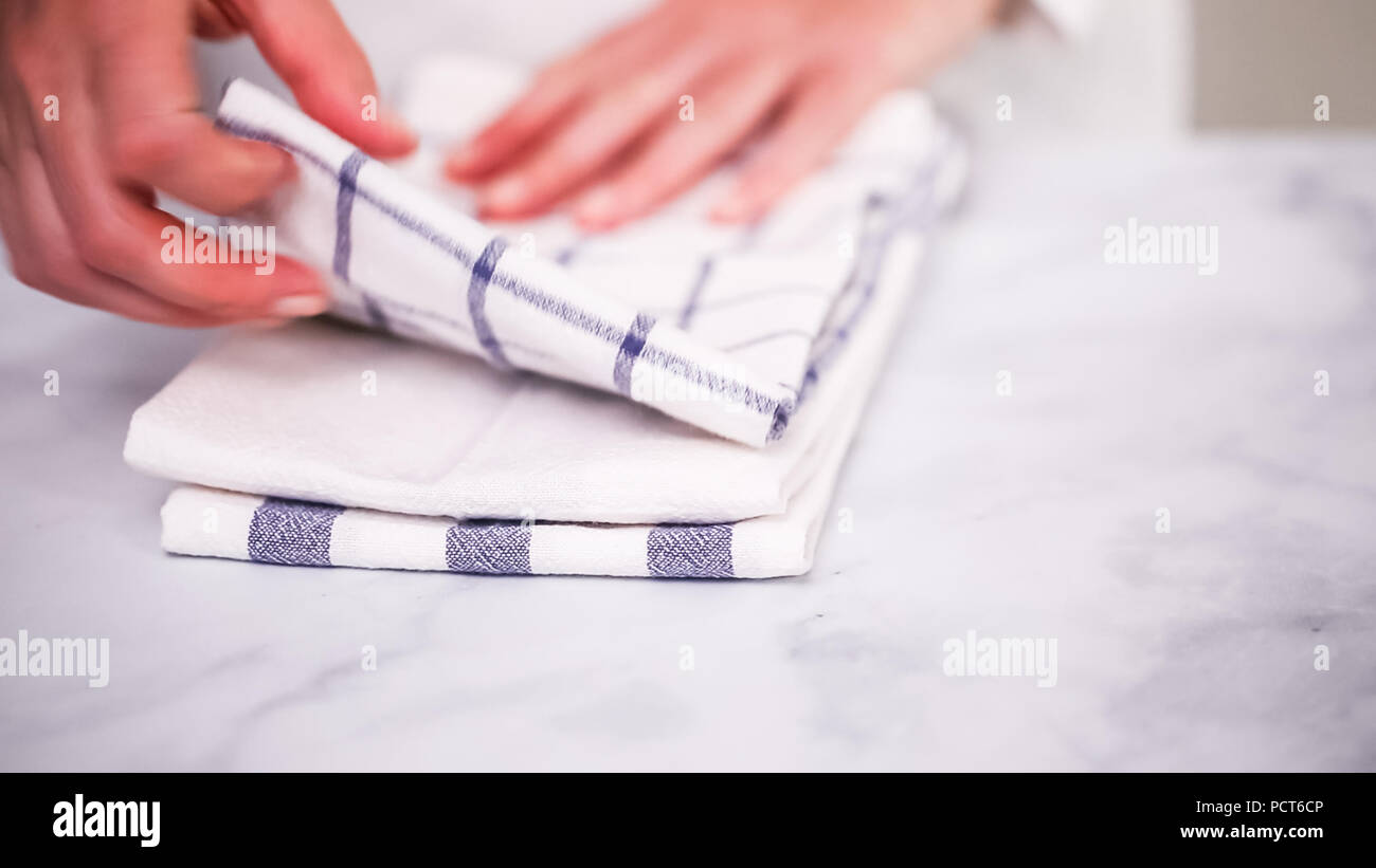 Folding blue and white patterned paper towels on marble surface Stock ...