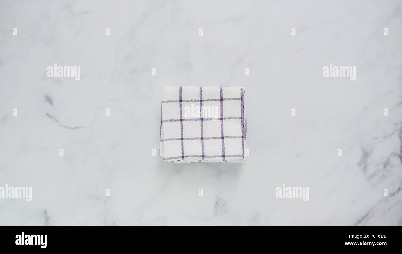 Folding blue and white patterned paper towels on marble surface Stock ...