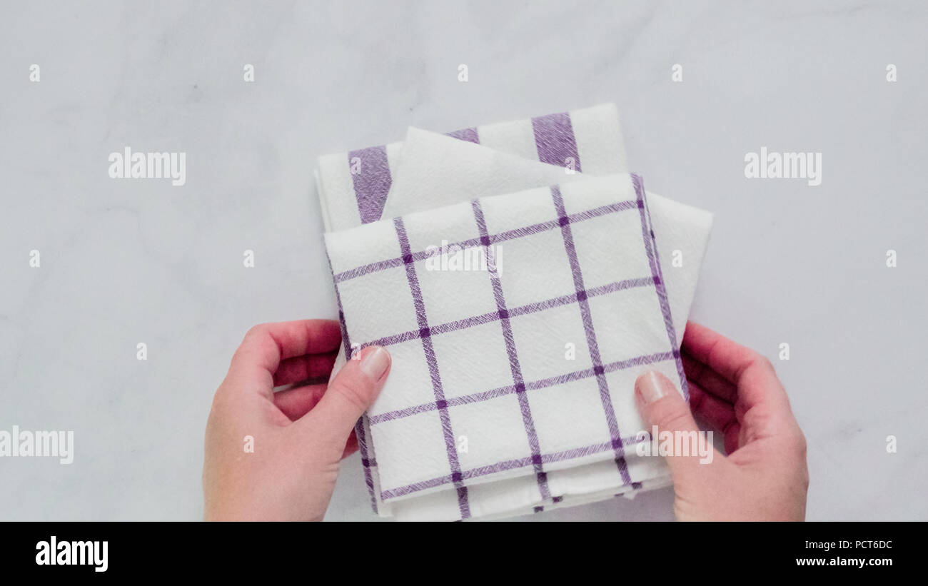 Folding blue and white patterned paper towels on marble surface Stock ...